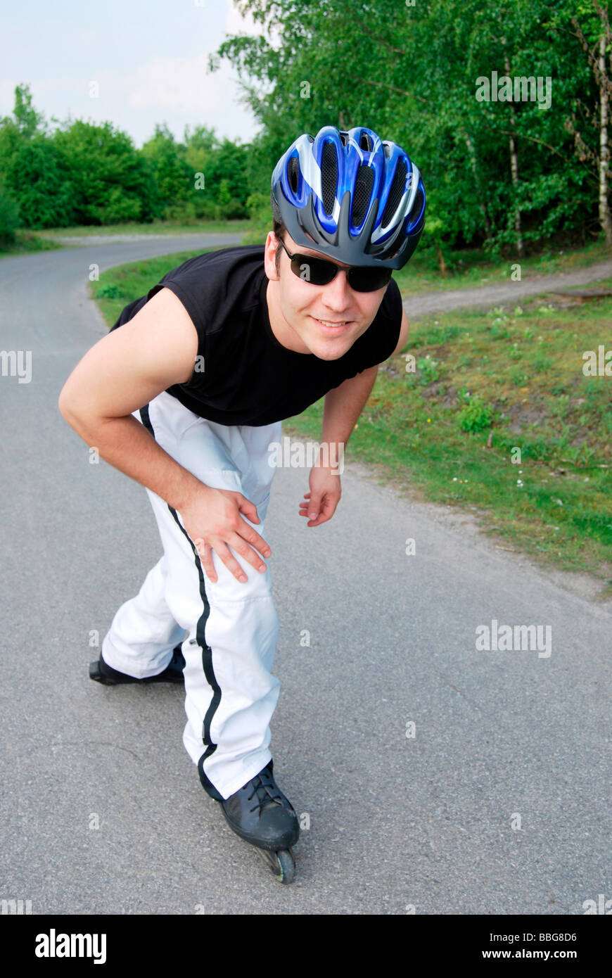 In-line skater wearing helmet and sunglasses Stock Photo - Alamy