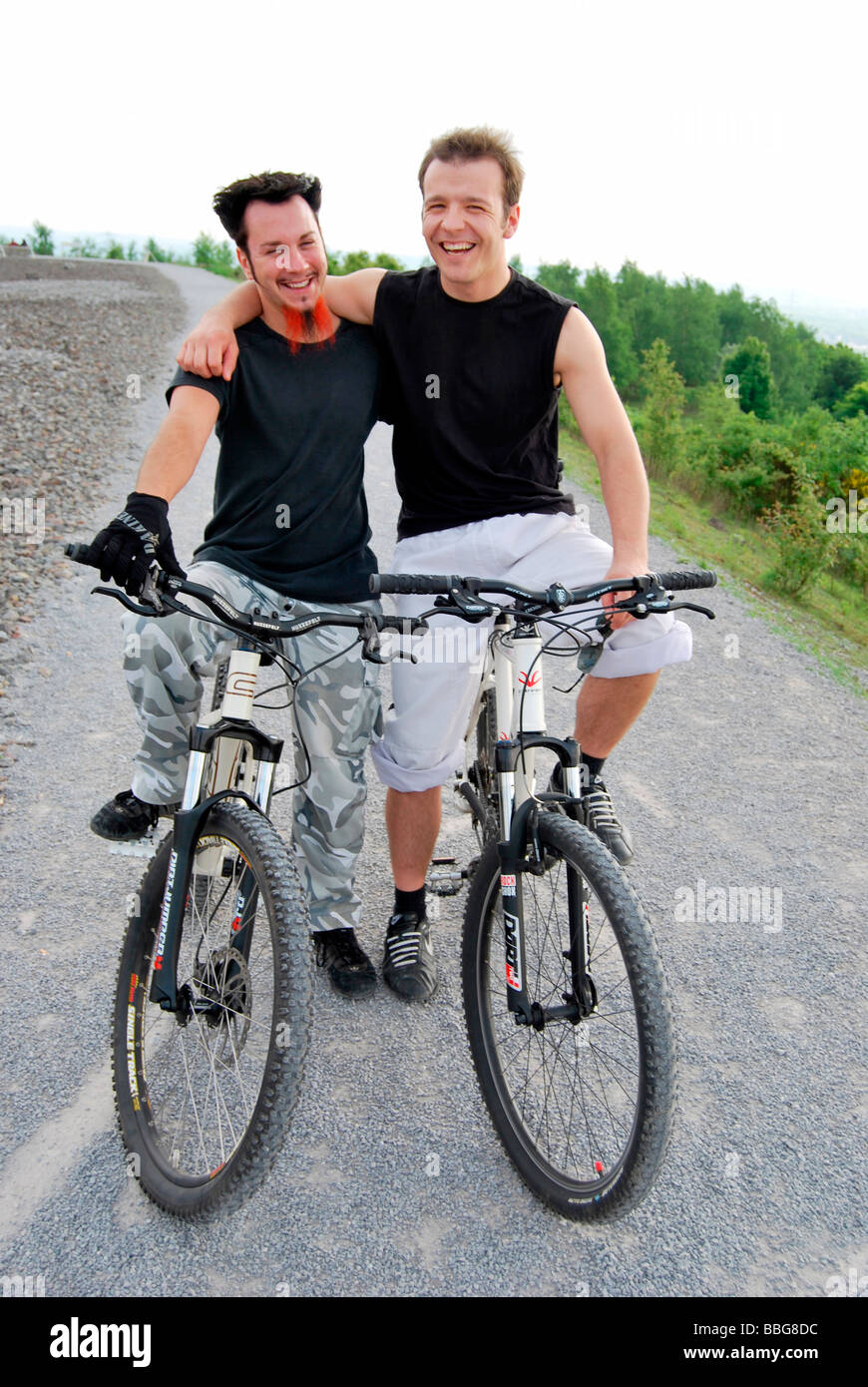 Friendship, two friends on mountain bikes Stock Photo - Alamy