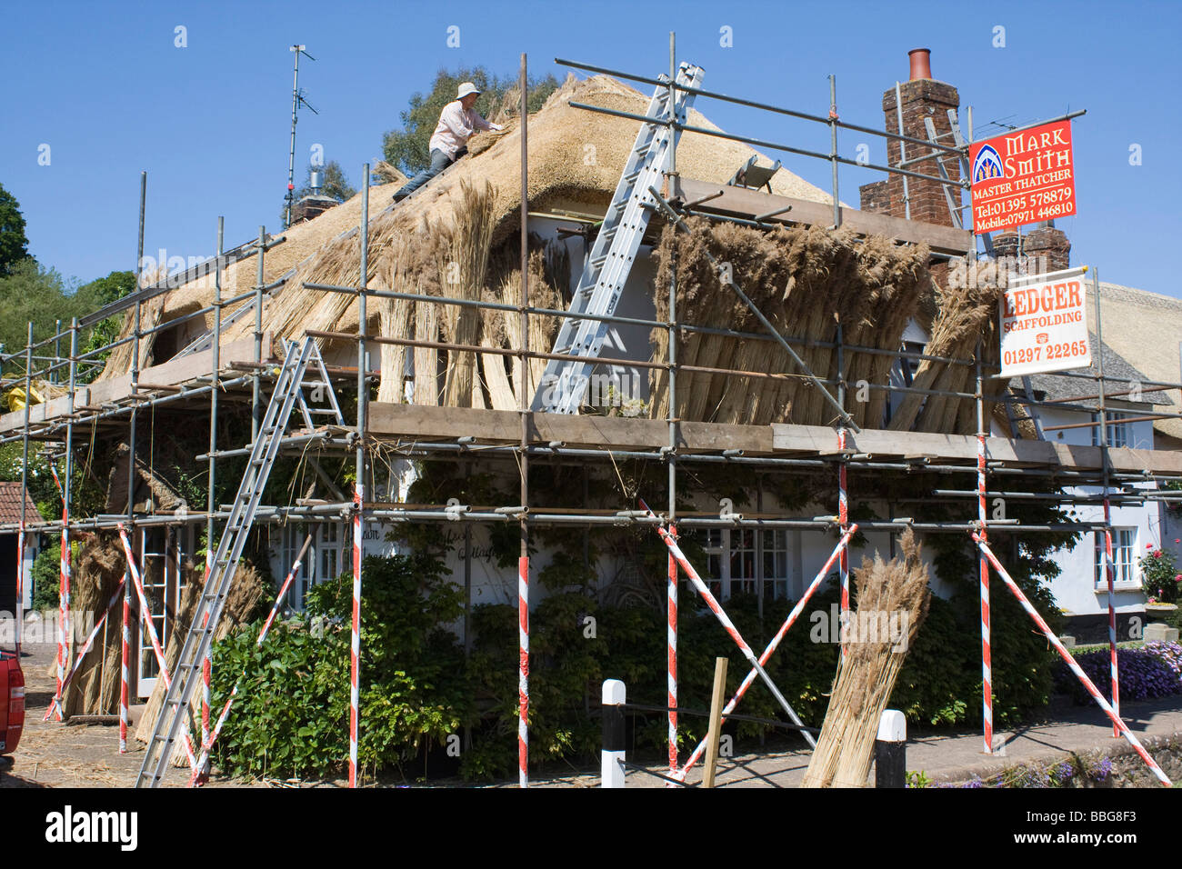 master thatcher re-roofing cottage roof south devon village otterton ...