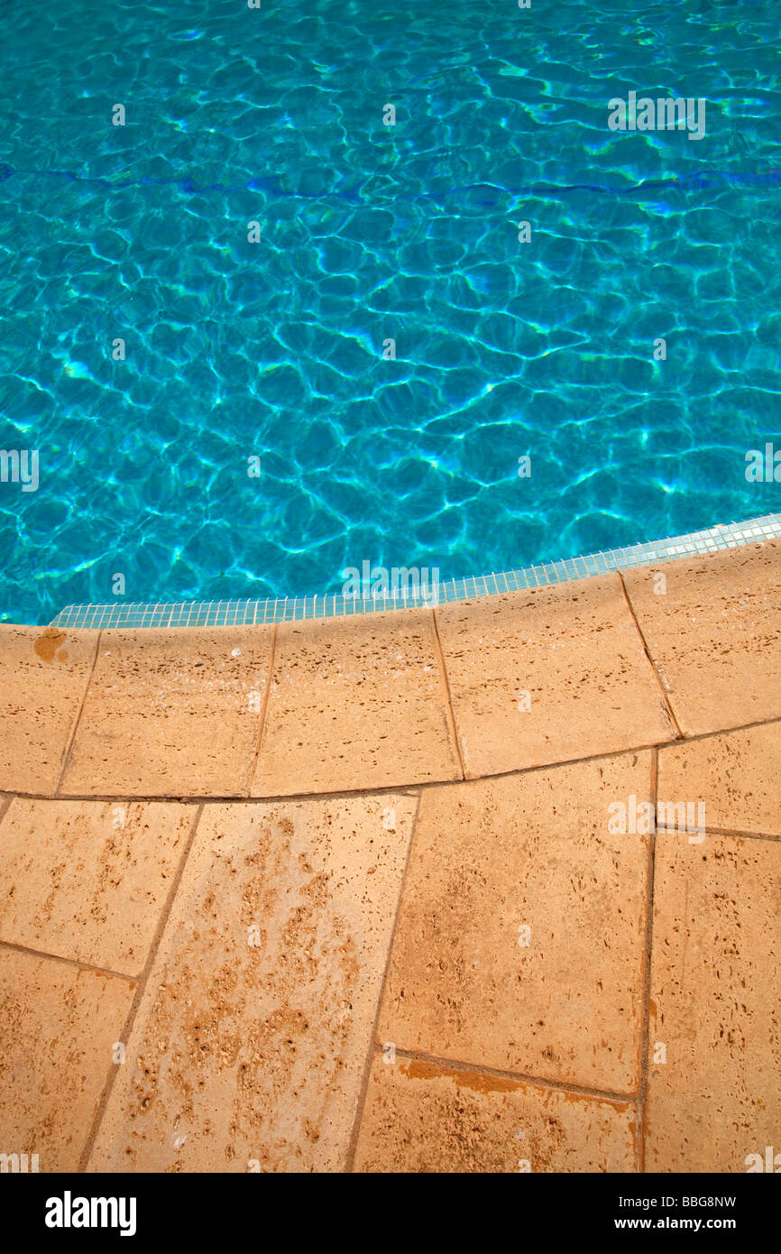 swimming pool blue water detail in summer time Stock Photo - Alamy