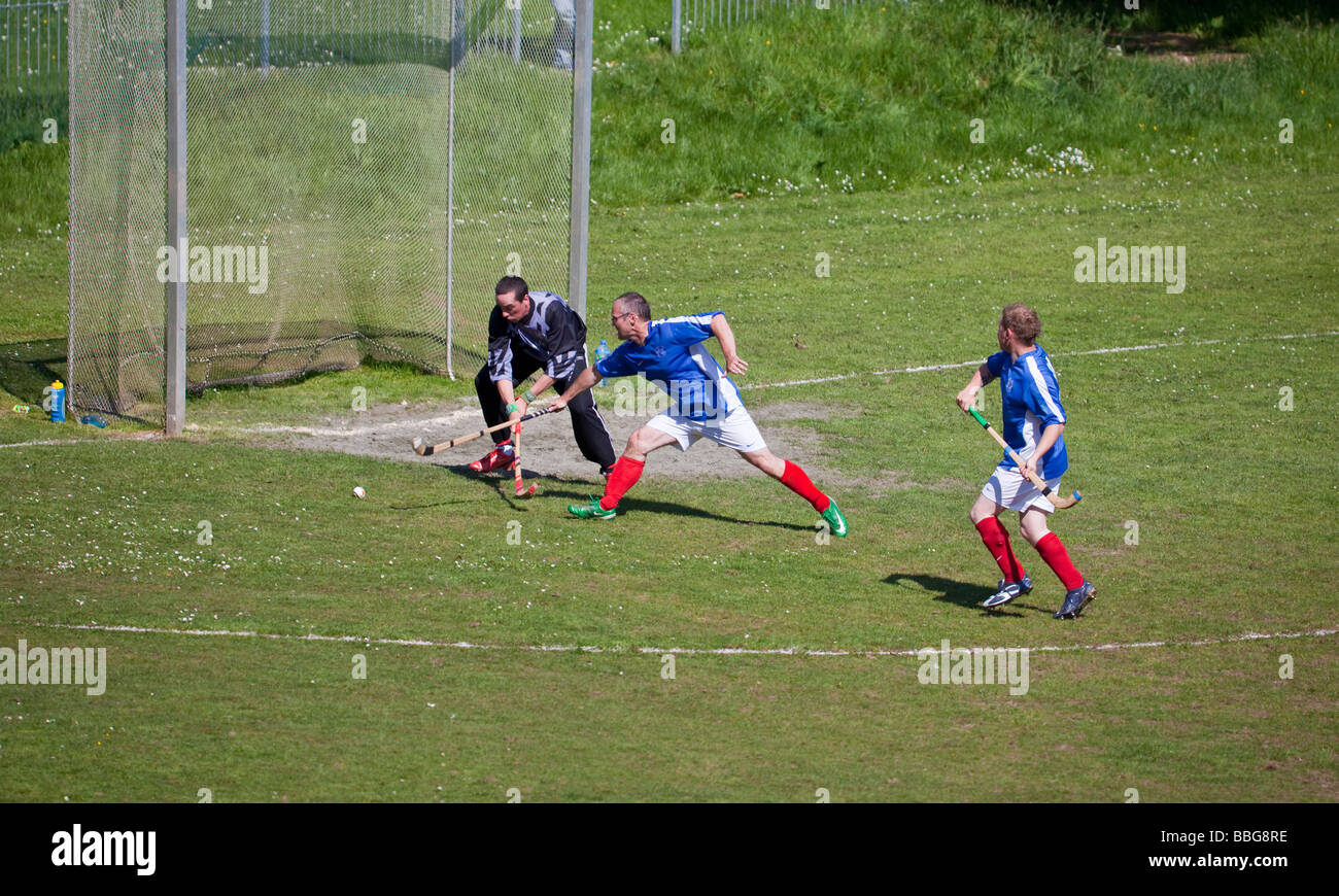 Shinty: Beating the goalkeeper during a game between Kyles Athletic and ...