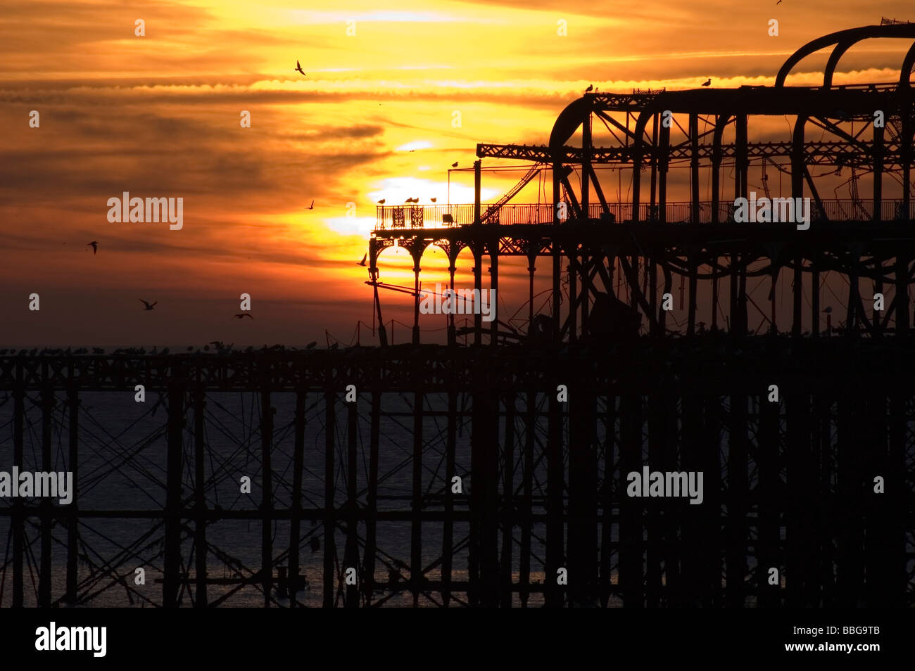Sunset over Brighton's derelict west pier Stock Photo - Alamy