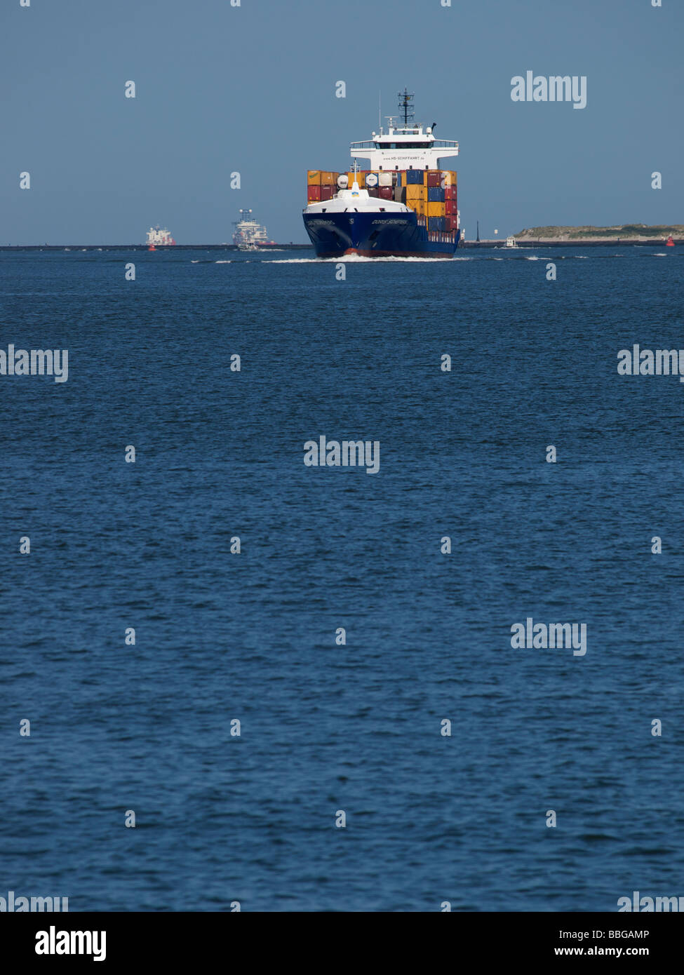 Container ship on the horizon approaching the port of Rotterdam Zuid ...