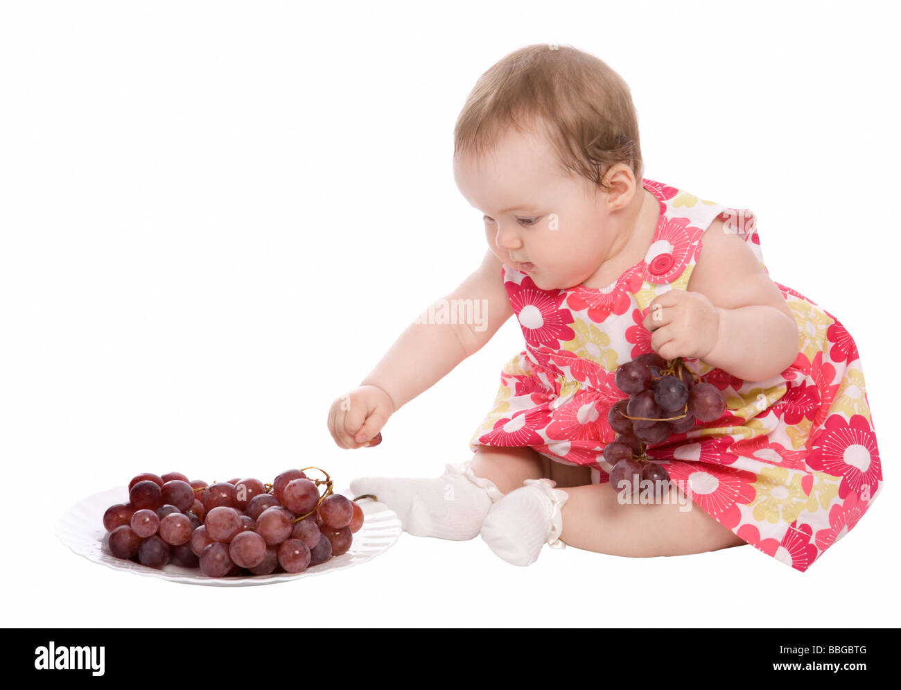 Hand holding grapes Cut Out Stock Images & Pictures - Alamy