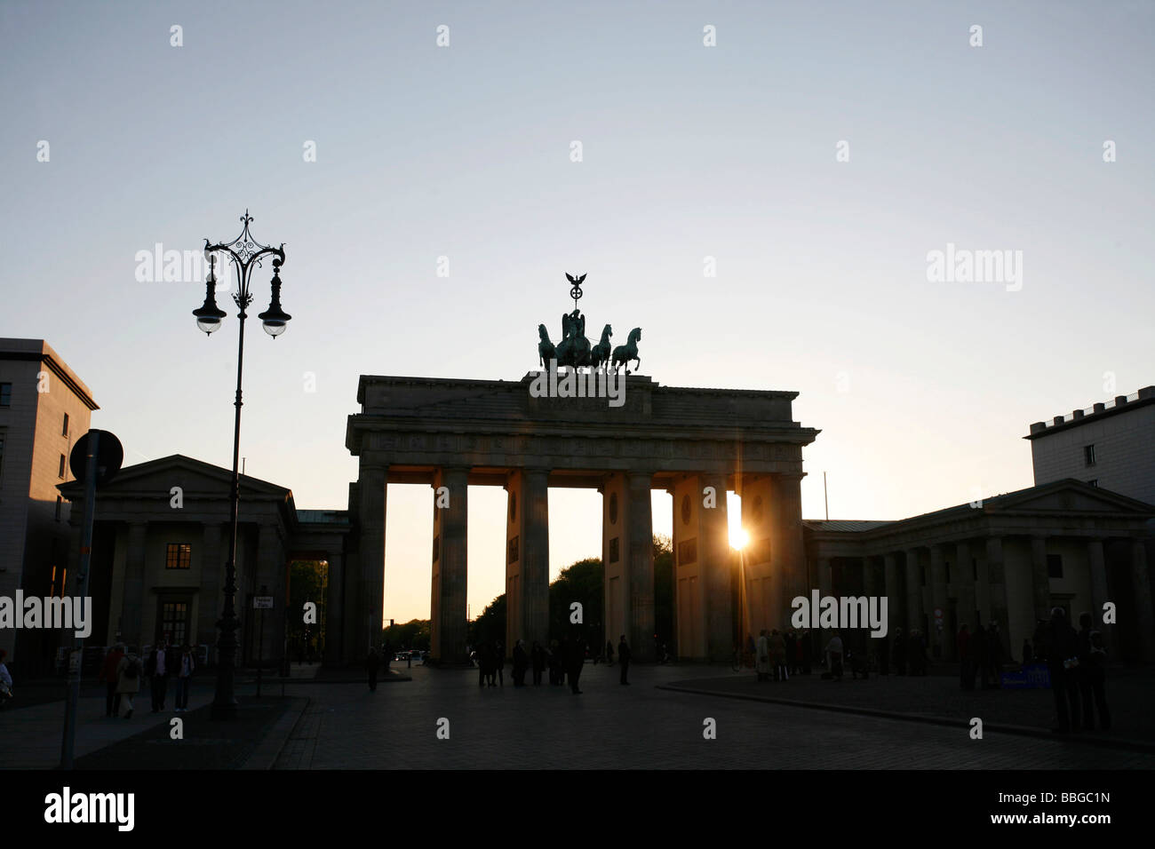 Sunset and silhouette of the Brandenburg Gate on Pariser Platz square ...