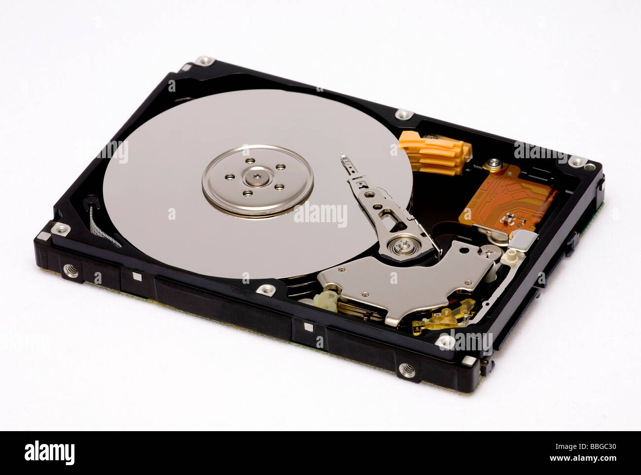 Uncovered computer hard disk with platters, head and other electronics ...