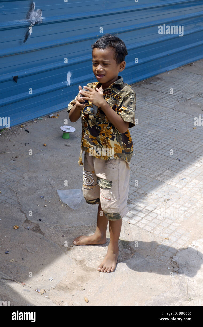 Cambodian kid begging for money in central Phnom Penh, Cambodia Stock ...