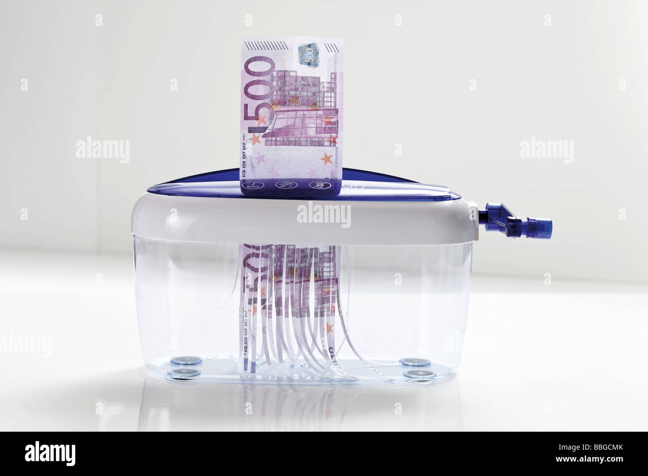Shredder with euro banknote Stock Photo - Alamy