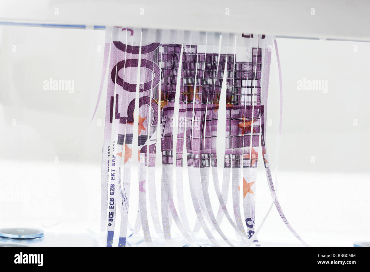 Shredder with euro banknote Stock Photo - Alamy