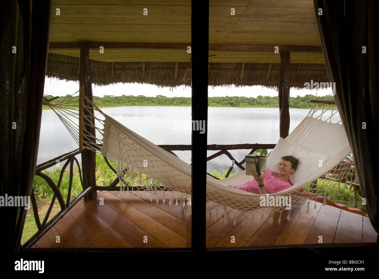 Woman reading in hammock - Napo Wildlife Center - Yasuni National Park ...