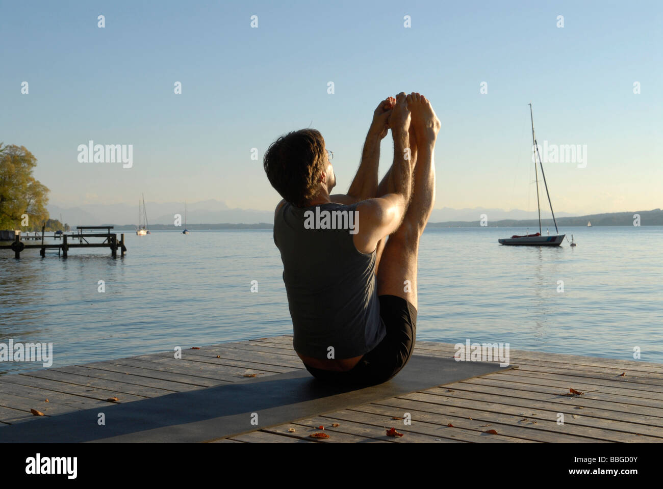 Back view of man doing stretching hi-res stock photography and images ...