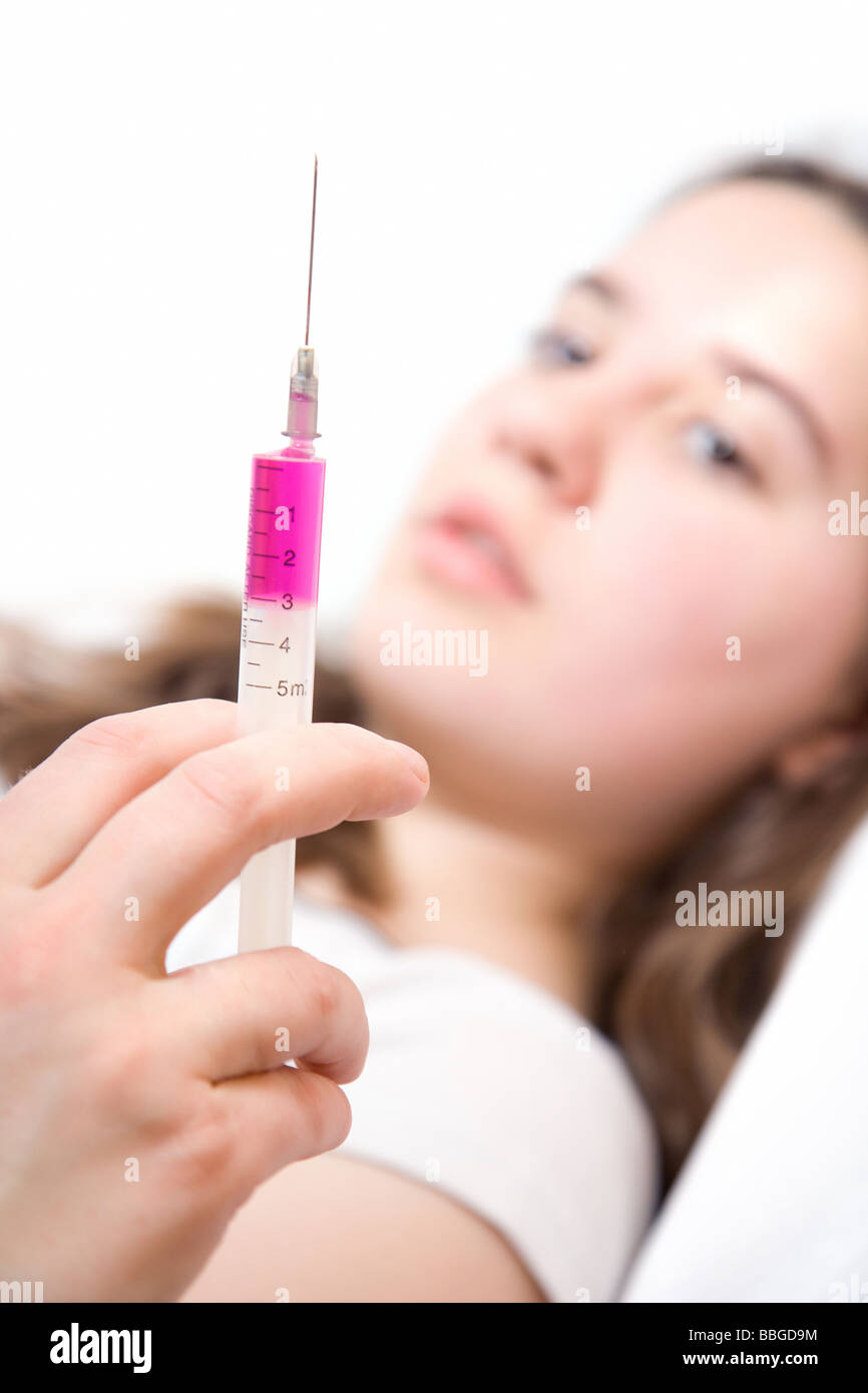 Doctor preparing vaccination injection isolate on white Stock Photo - Alamy