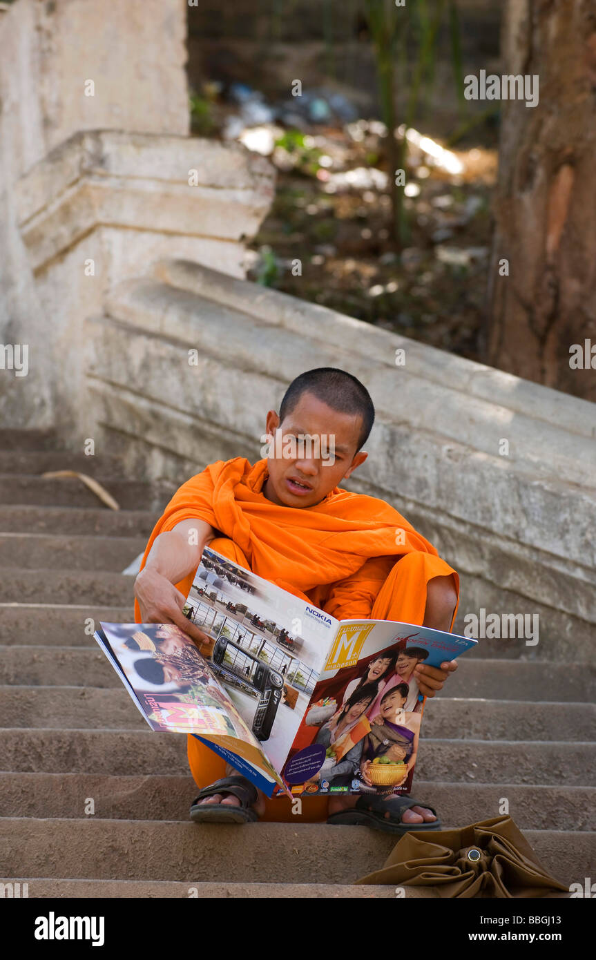 Buddhistic monk reading a magazine hi-res stock photography and images ...