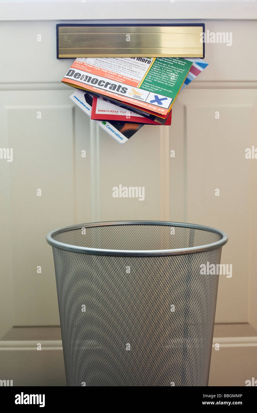 Election leaflets coming through letterbox with a bin below Stock Photo ...