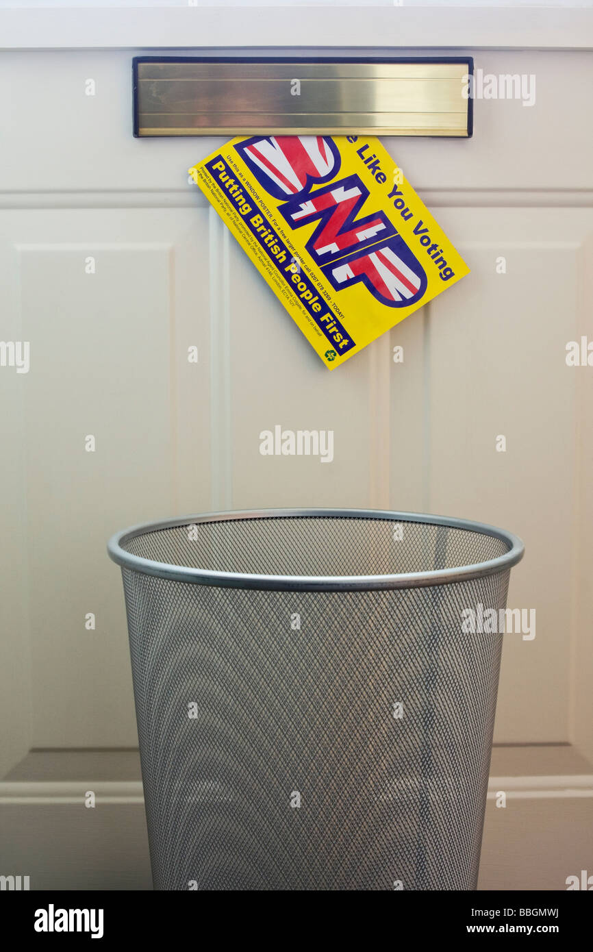 Election leaflets coming through letterbox with a bin below Stock Photo ...