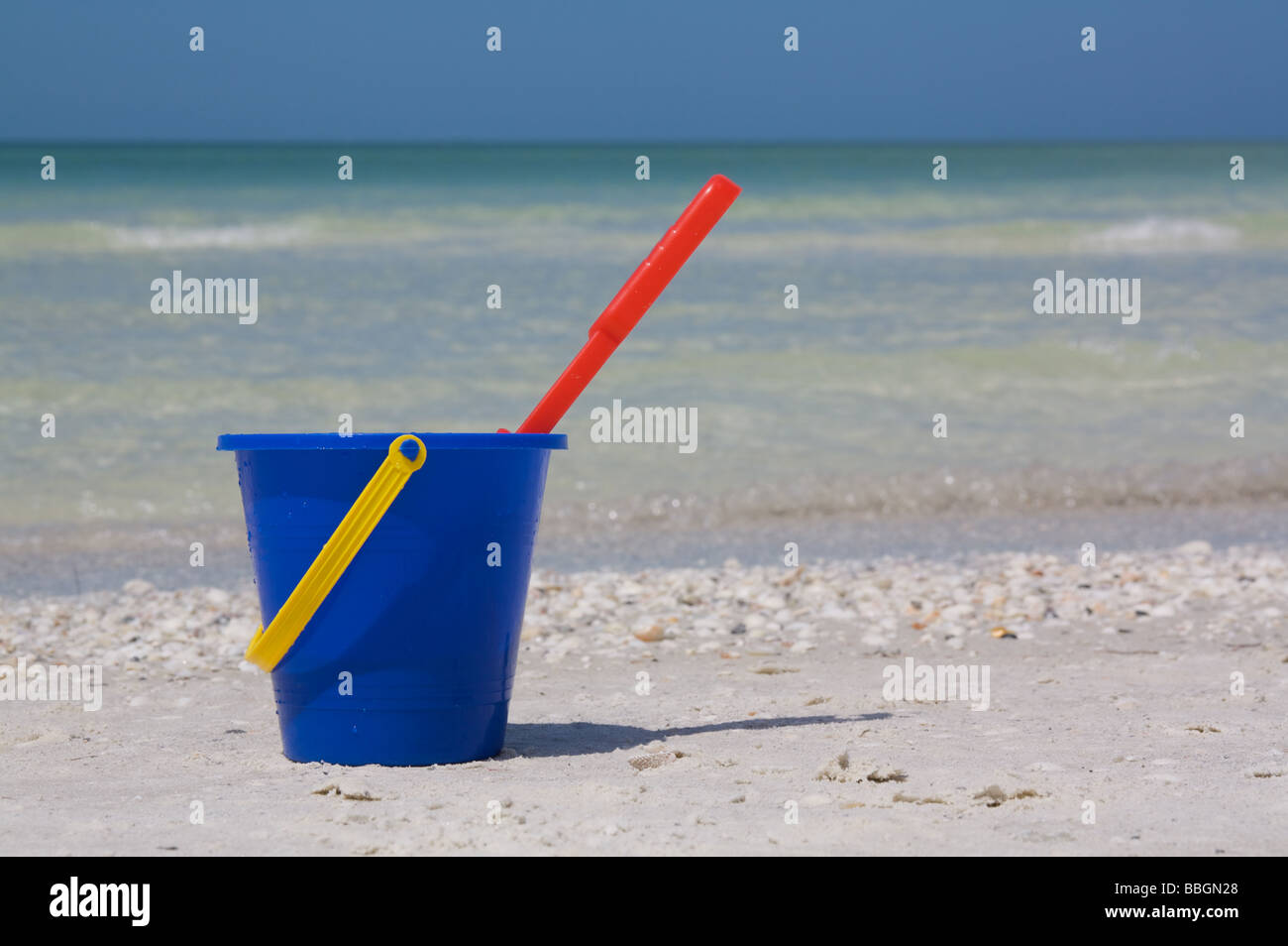 Bucket at beach Stock Photo - Alamy
