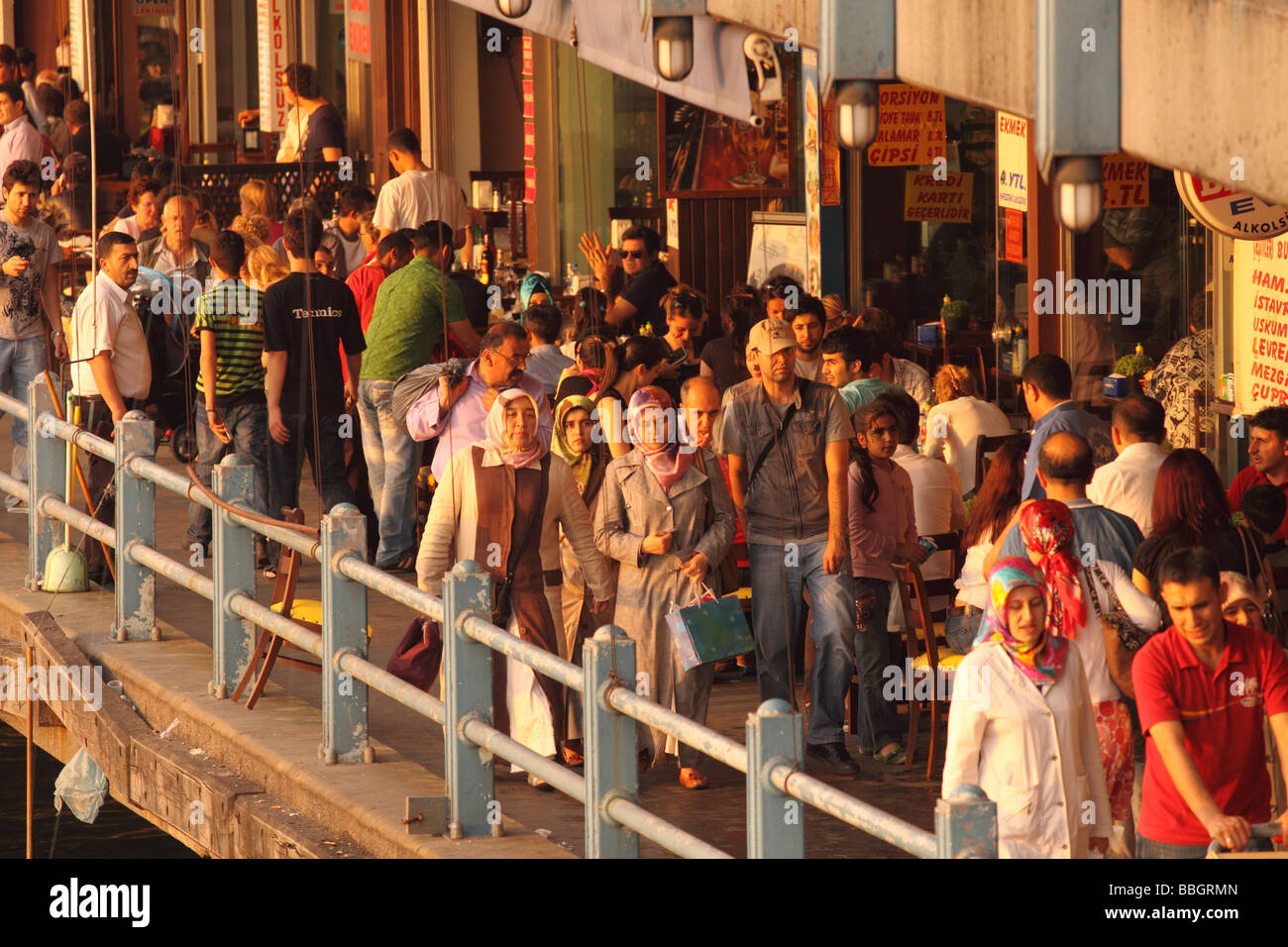 Istanbul Turkey busy scene on the lower tier of the Galata Bridge with ...