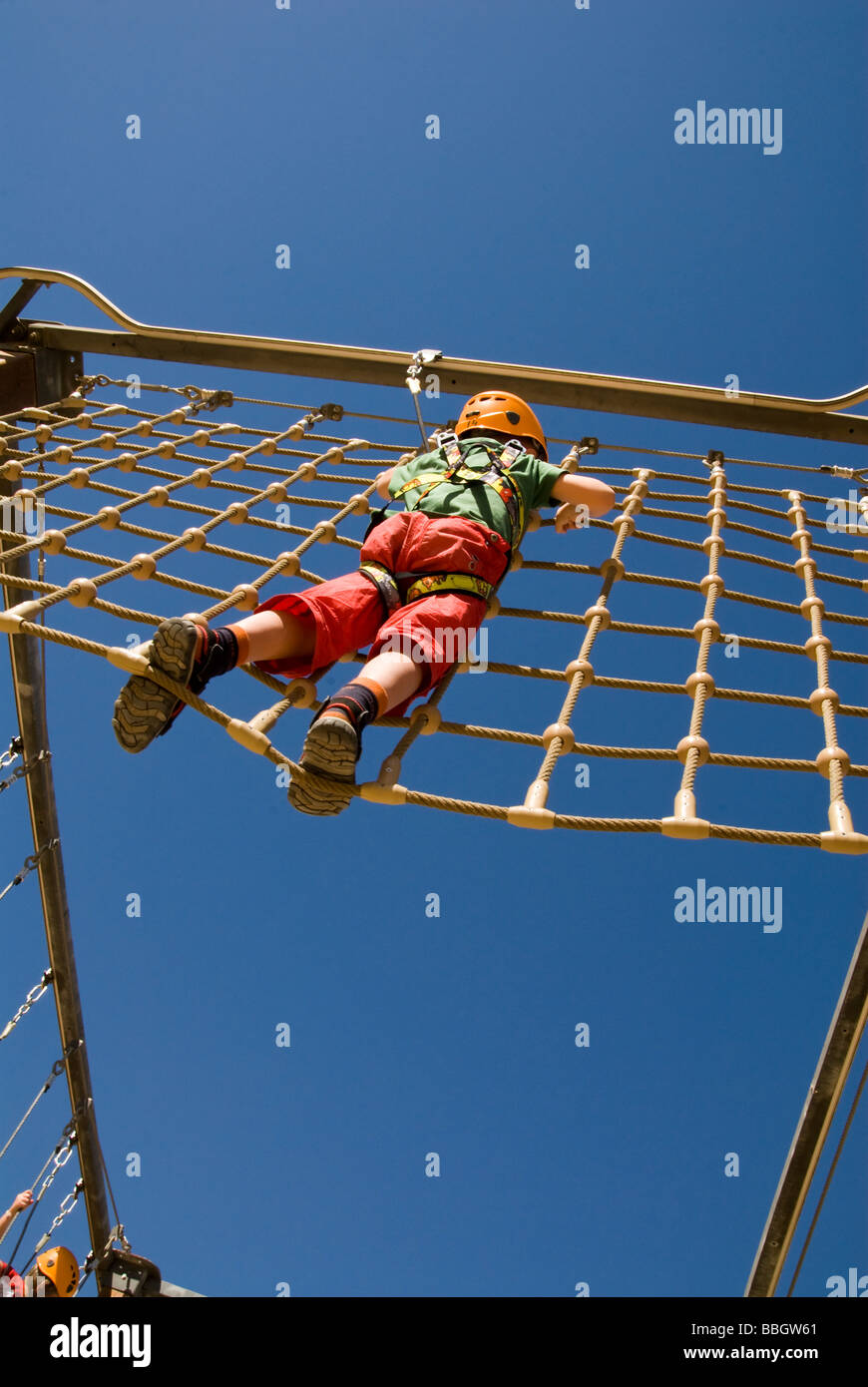 young boy climbing a net Stock Photo - Alamy