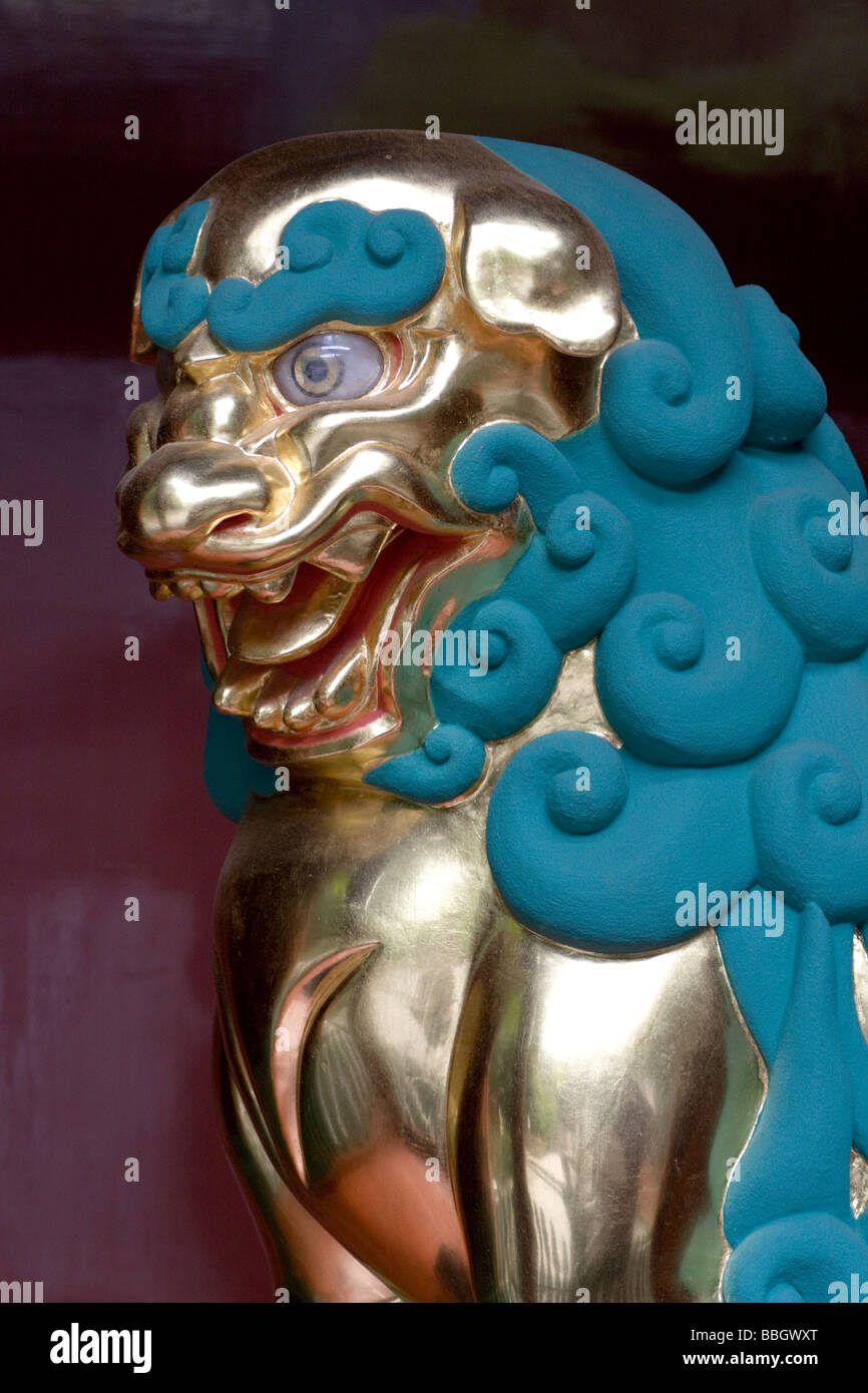 A golden lion guarding the gates to a temple in Japan Stock Photo - Alamy