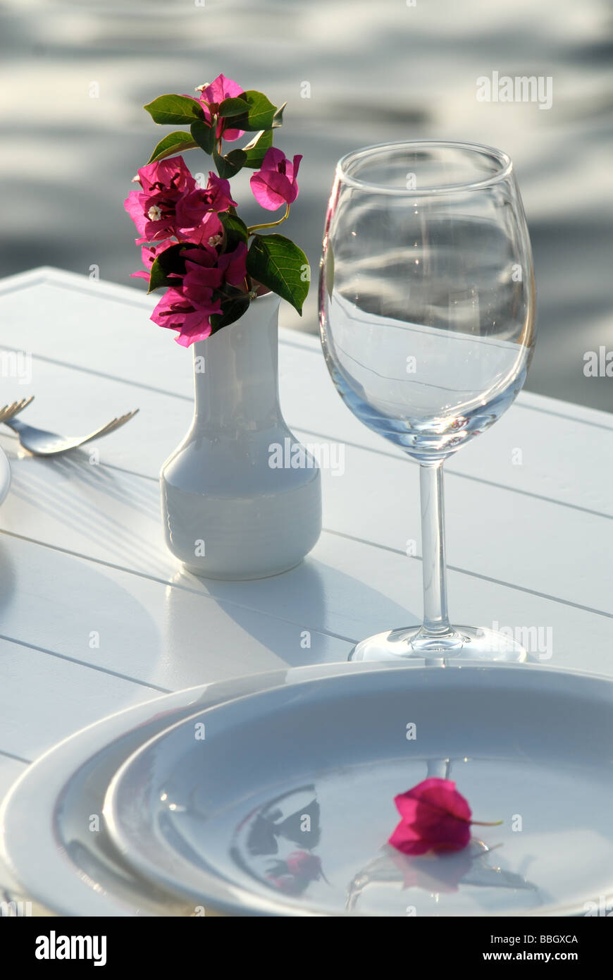 dinner table and nice place setting at the beach restaurant Stock Photo ...