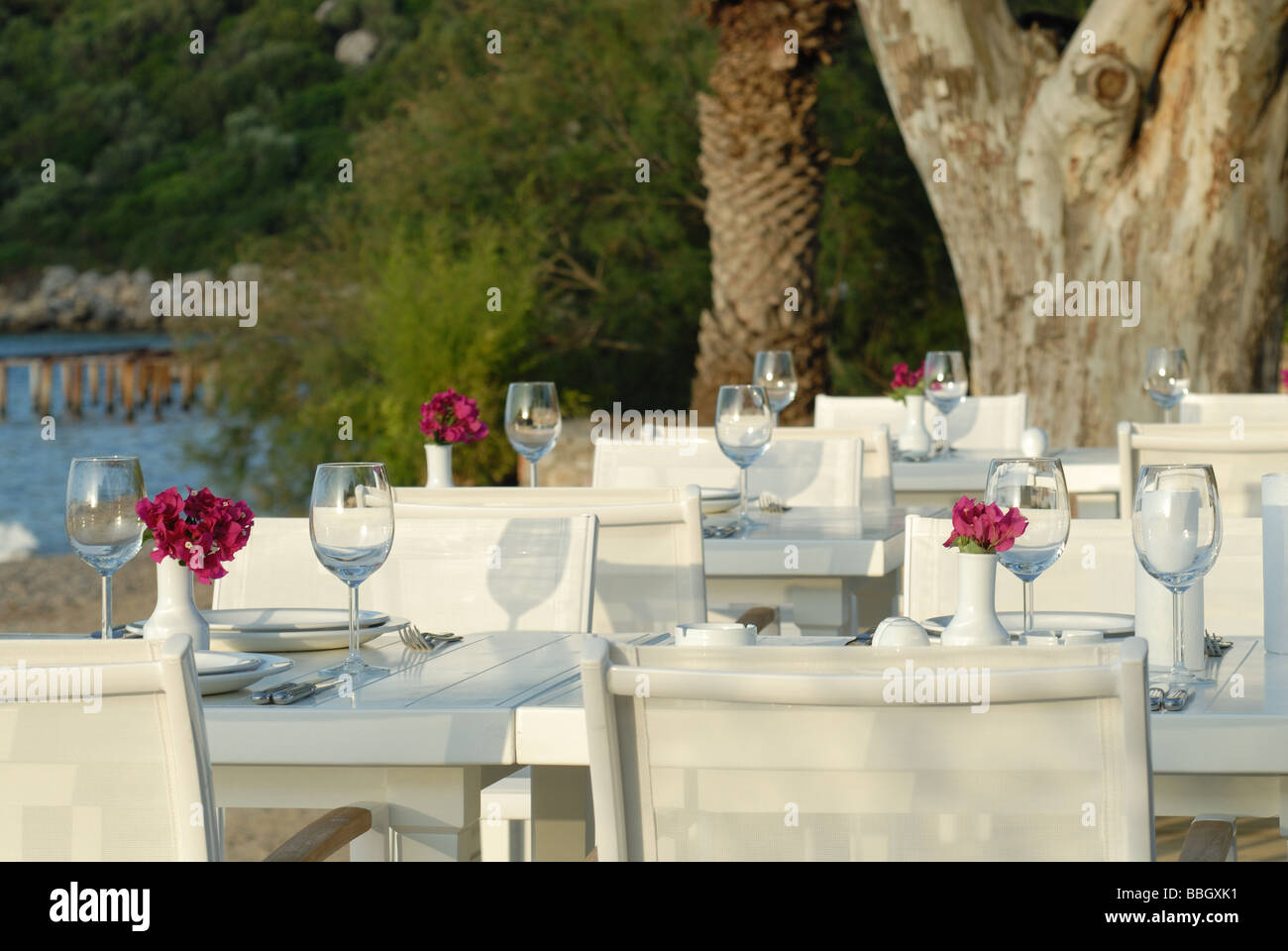 dinner table and nice place setting at the beach restaurant Stock Photo ...