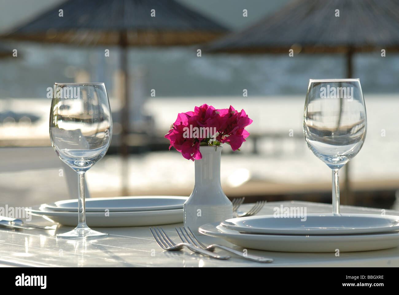 dinner table and nice place setting at the beach restaurant Stock Photo ...