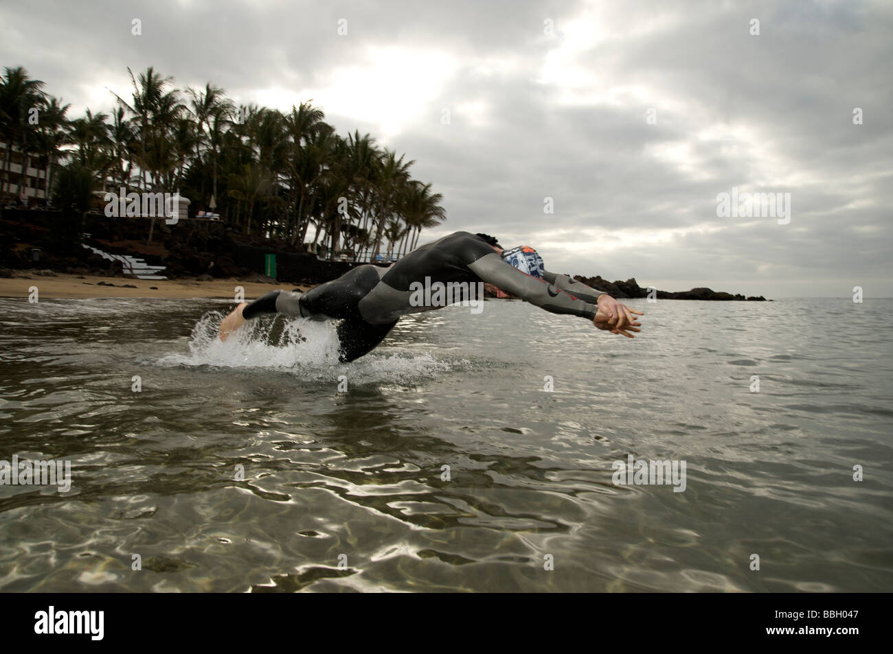 Male athlete diving into the Atlantic Ocean Stock Photo - Alamy