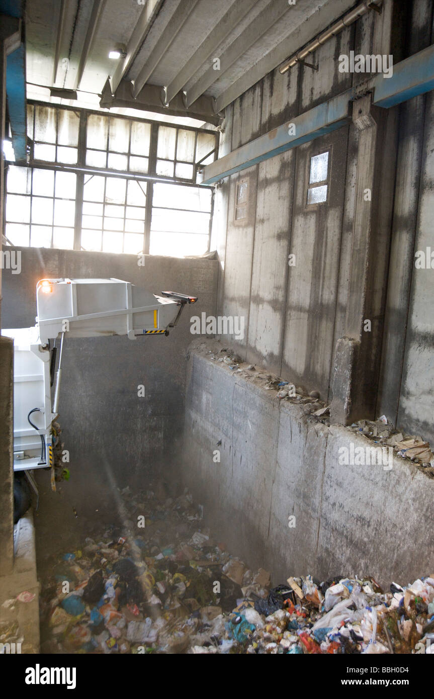 A garbage truck dumps its load at a transfer station Stock Photo - Alamy