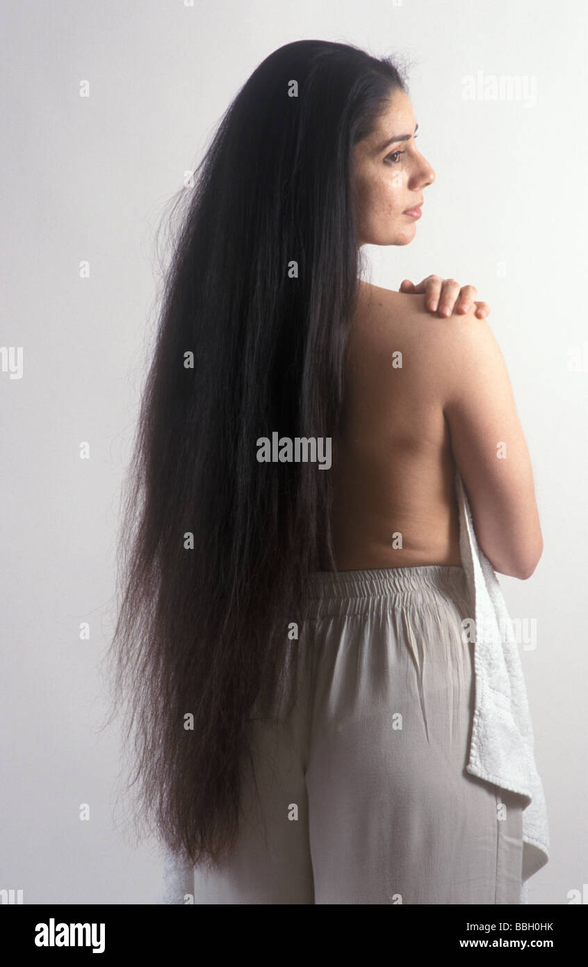 woman with very long hair reaching below her bottom Stock Photo - Alamy