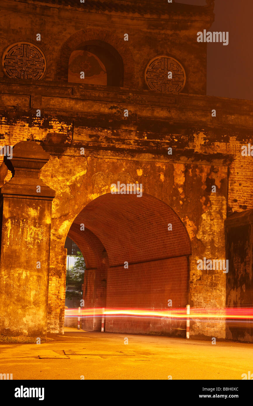 Light trail from a motorbike passing through the "Ngan Gate" at night ...