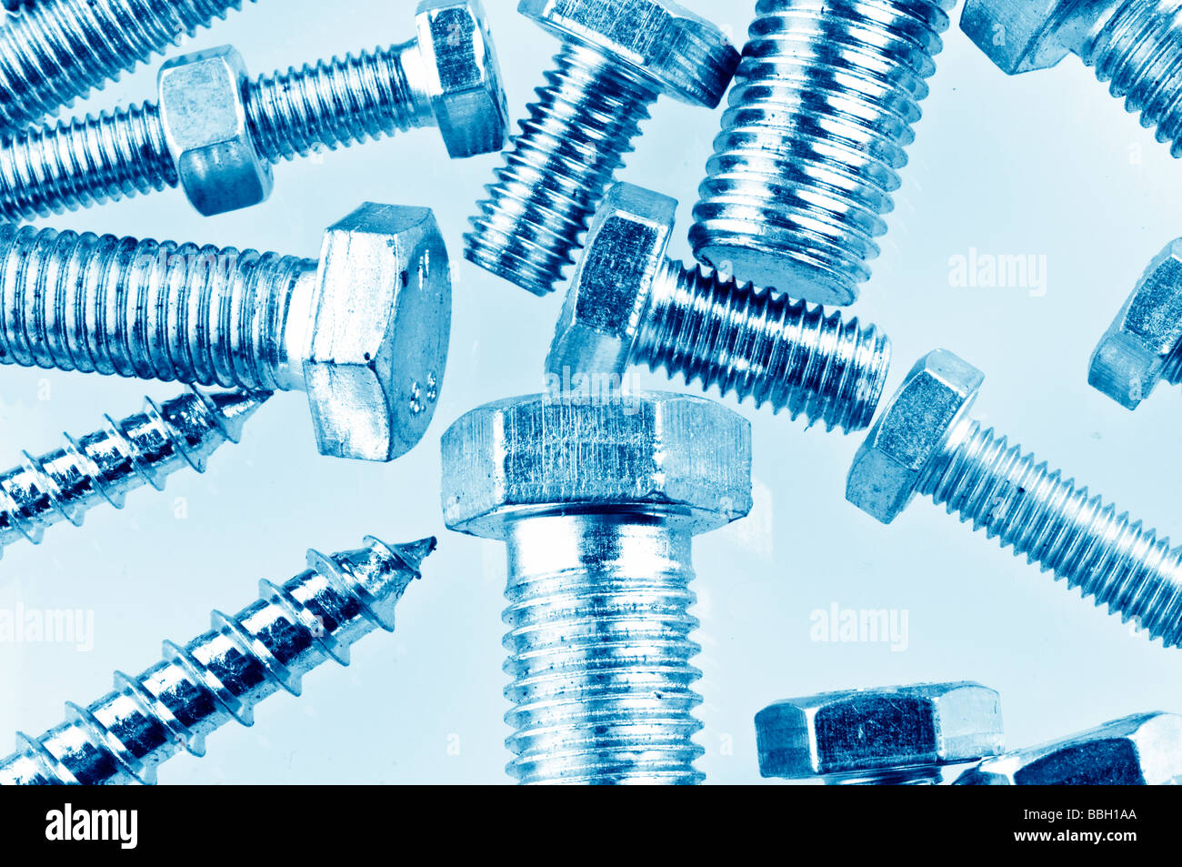 Bolts and nuts in blue tones Stock Photo - Alamy
