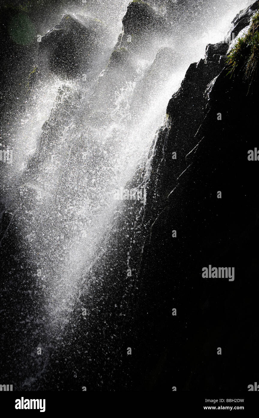 A waterfall on the beach at Clovelly in Devon, England, UK Stock Photo ...