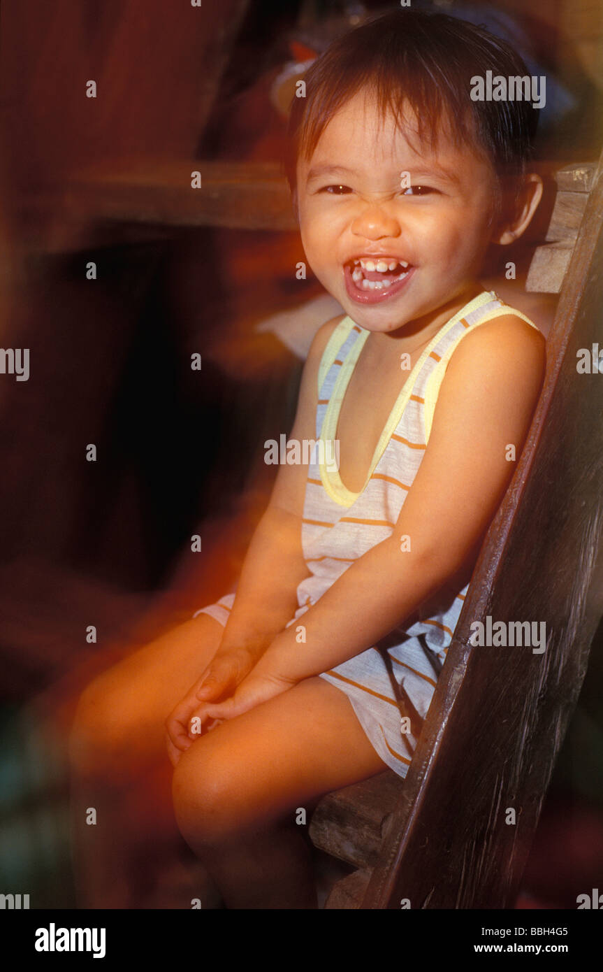 Young child sitting Stock Photo - Alamy