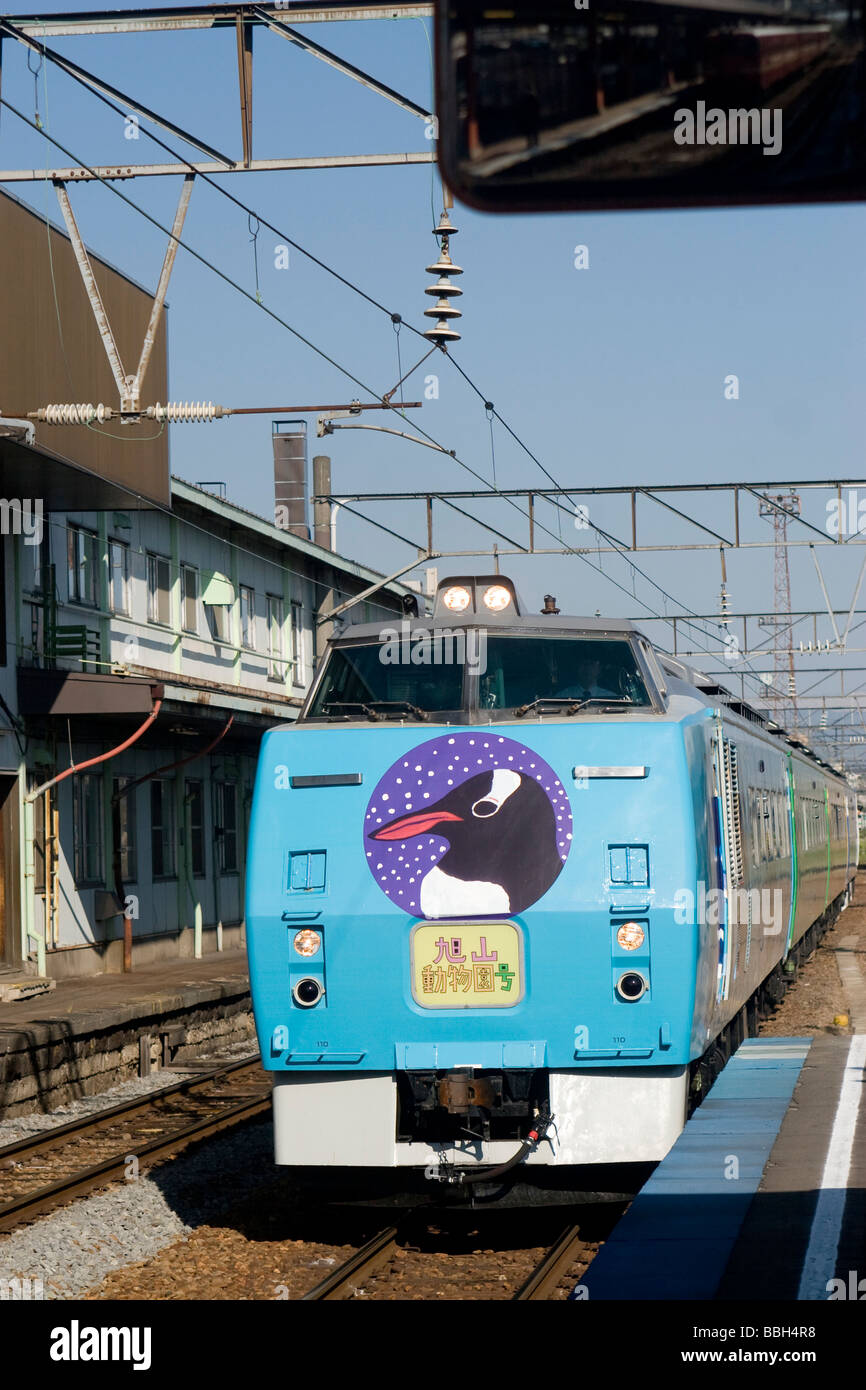 The Asahiyama Zoo train with its penguin motif approaches Asahiyama ...