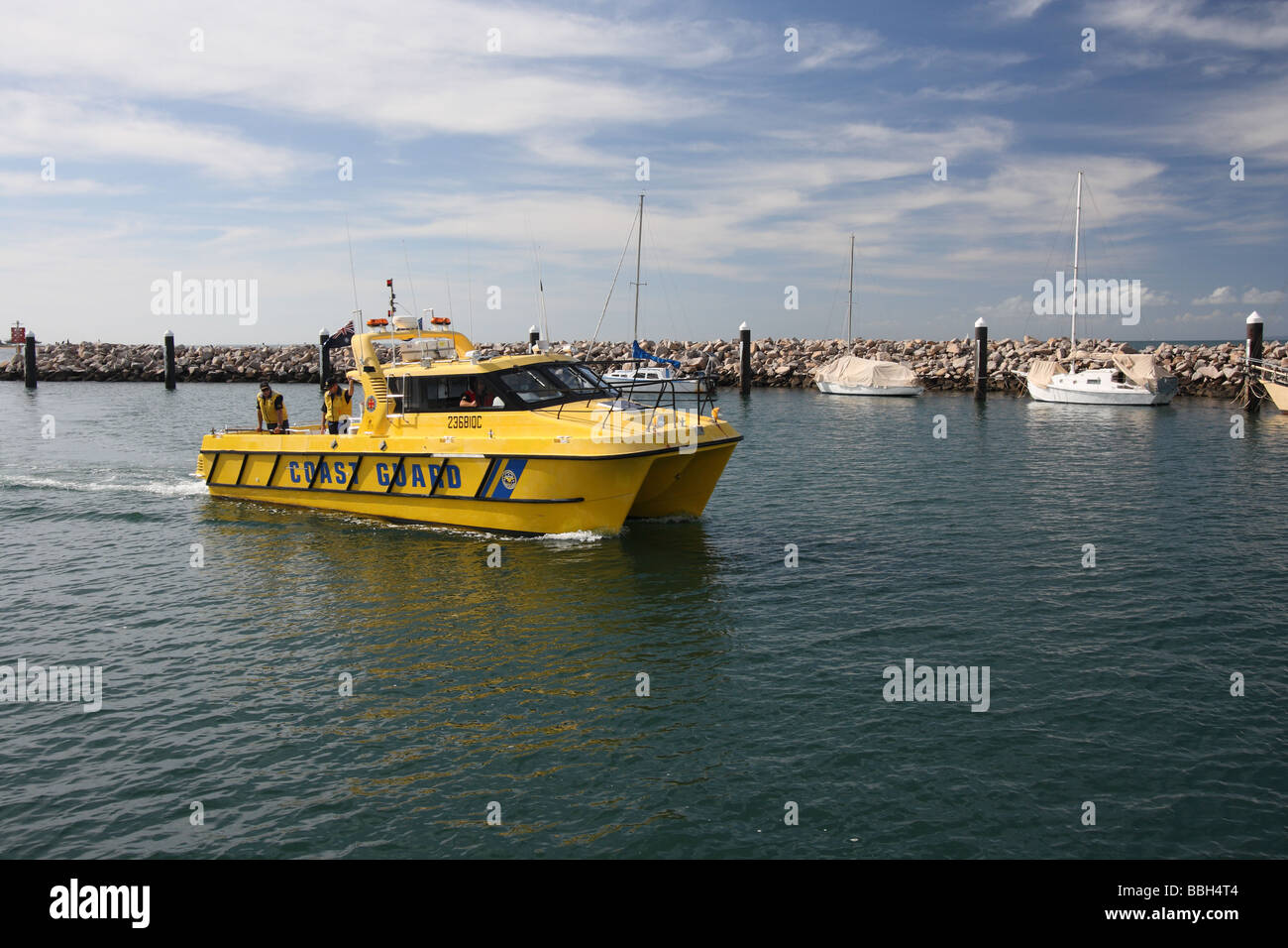 YELLOW COAST GUARD VESSEL LEAVING PORT IN QUEENSLAND AUSTRALIA ...