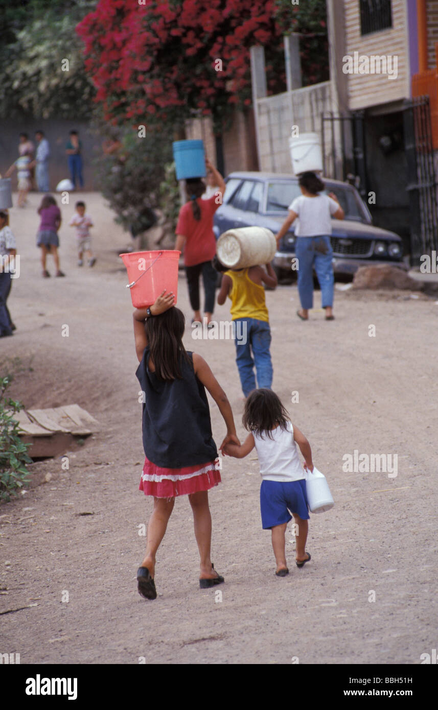 Buckets being carried Stock Photo - Alamy