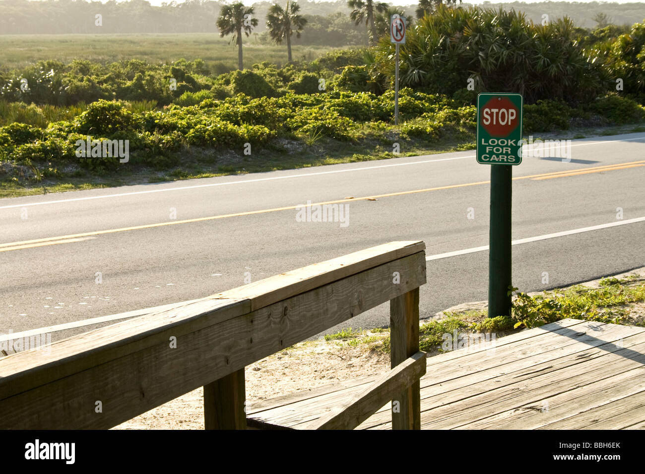 Sign by a roadside warning 'Stop look for cars' Stock Photo - Alamy