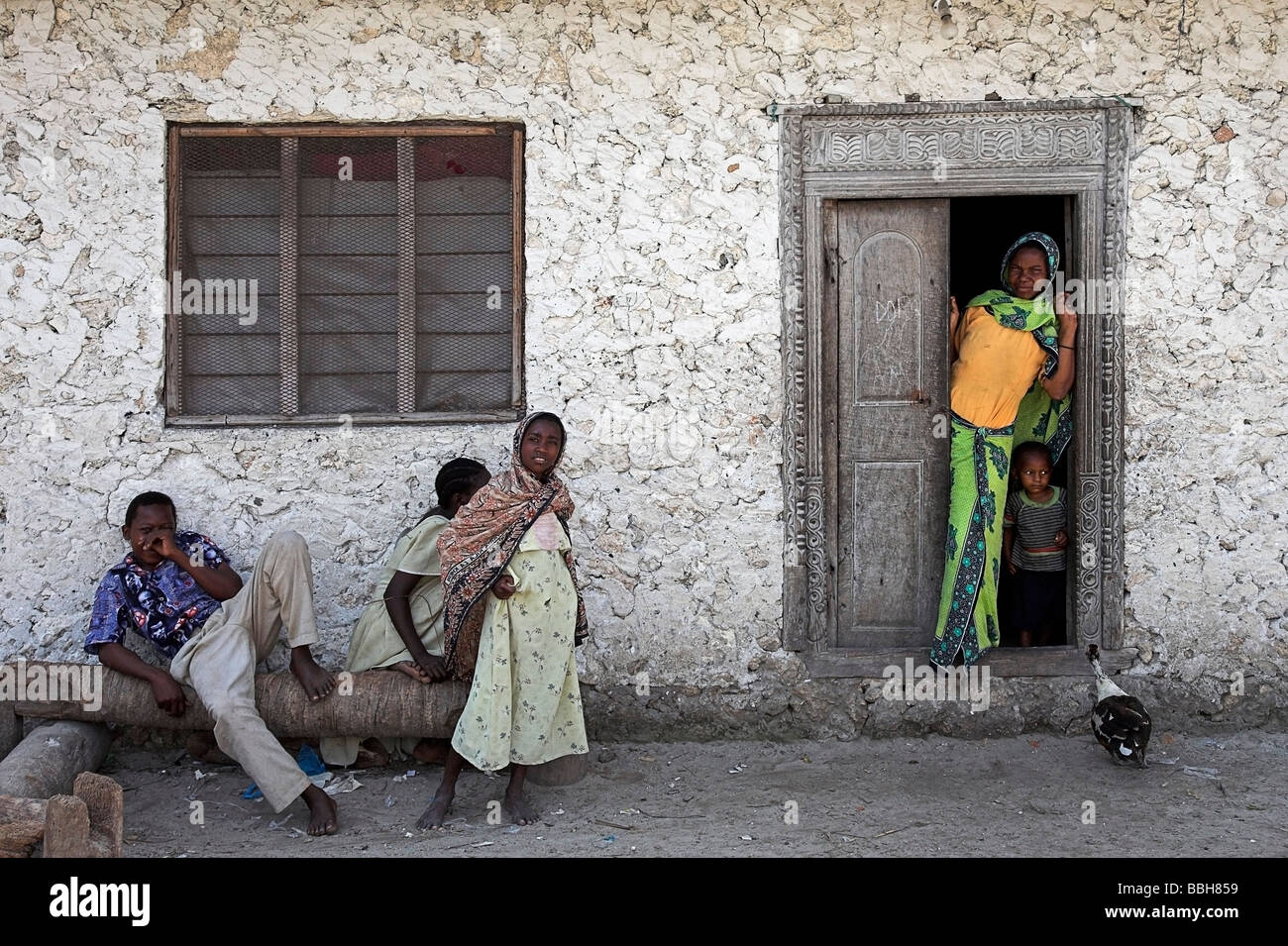 Pwani Mchangani, Zanzibar, Tanzania; Family outside house Stock Photo ...