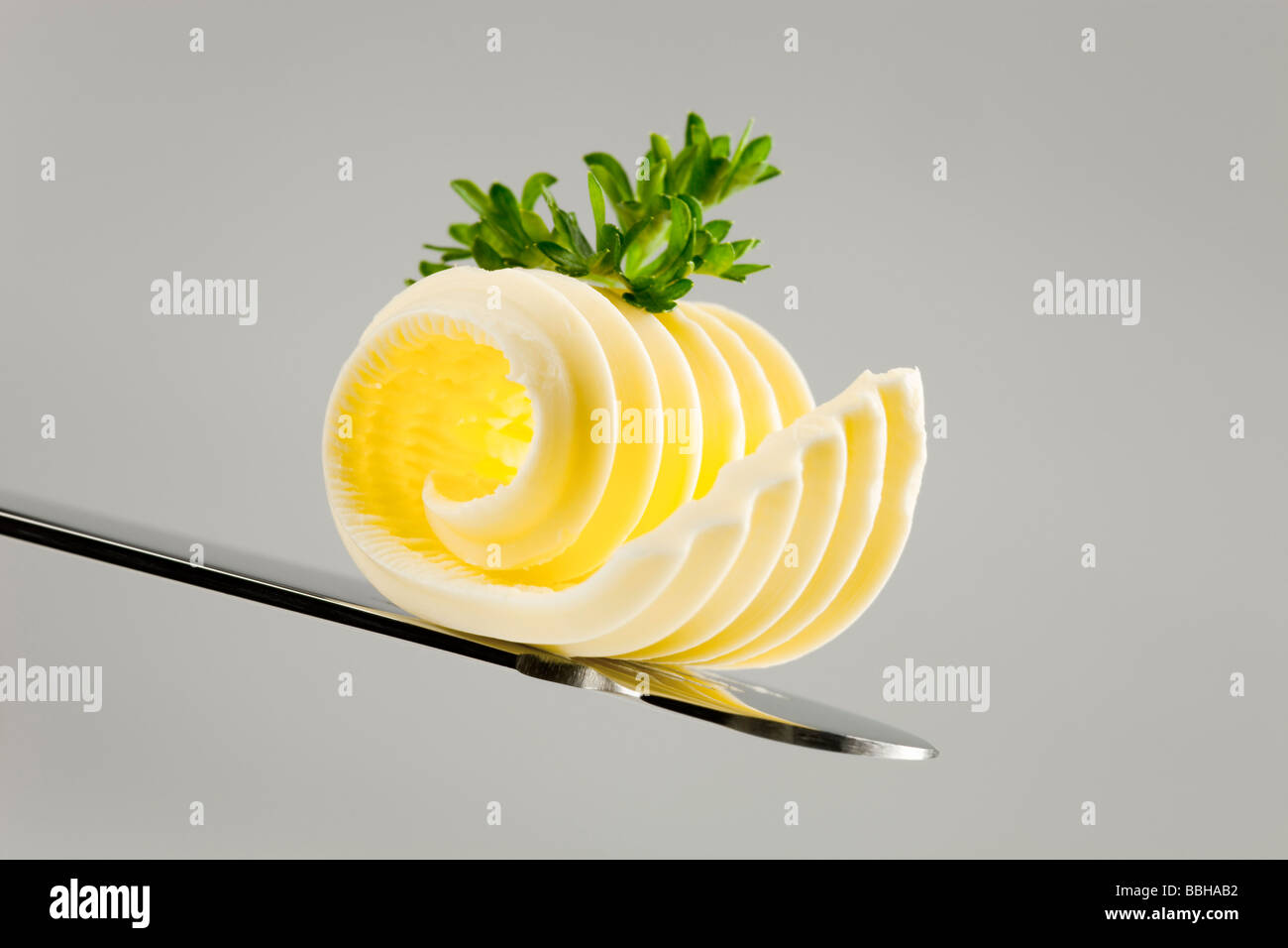 Butter curl on a knife Stock Photo - Alamy