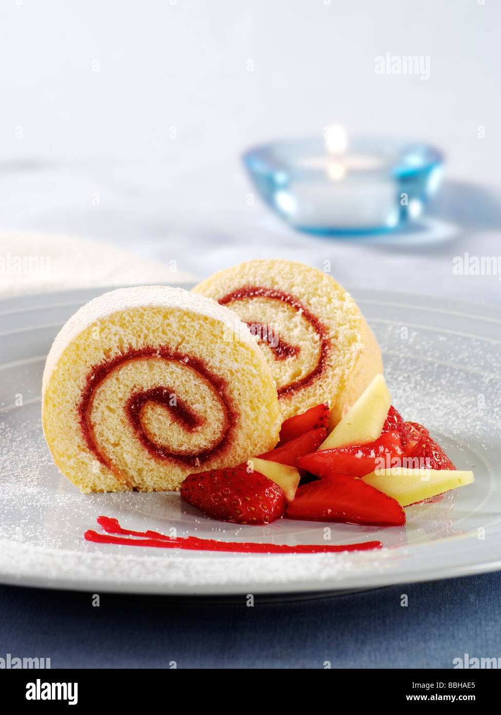 Strawberry jam Swiss roll Stock Photo - Alamy