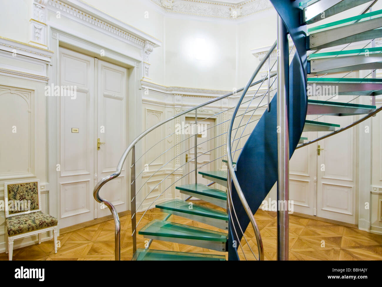 Hotel hallway with a modern spiral staircase Stock Photo - Alamy