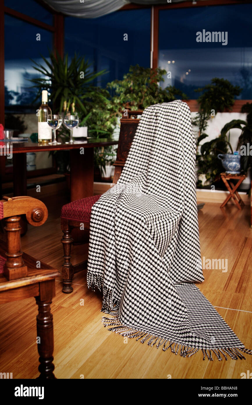 Throw draped over an antique chair Stock Photo - Alamy