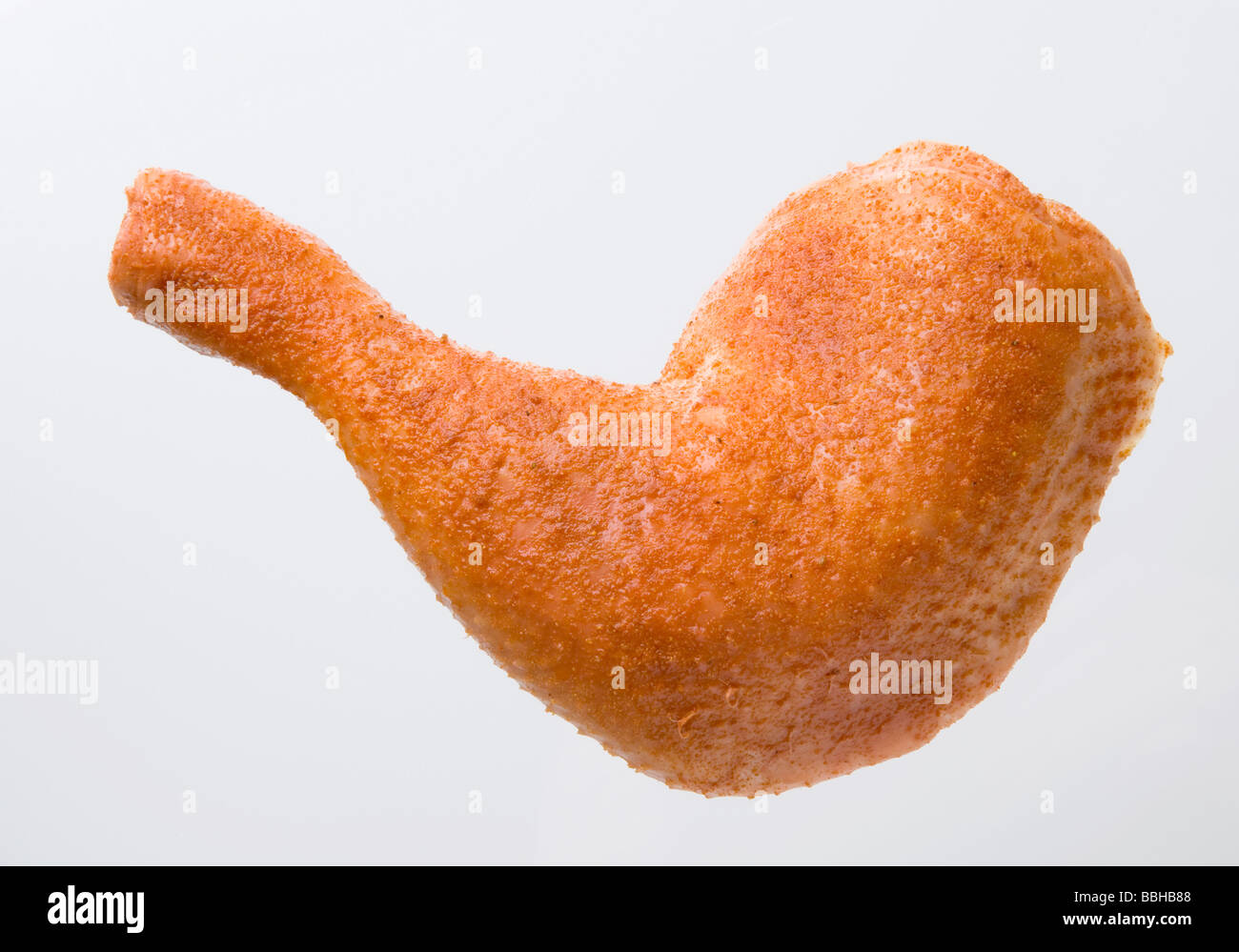 Spiced chicken leg Stock Photo - Alamy