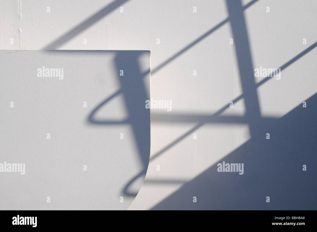 Railing shadow on a stucco wall Stock Photo - Alamy