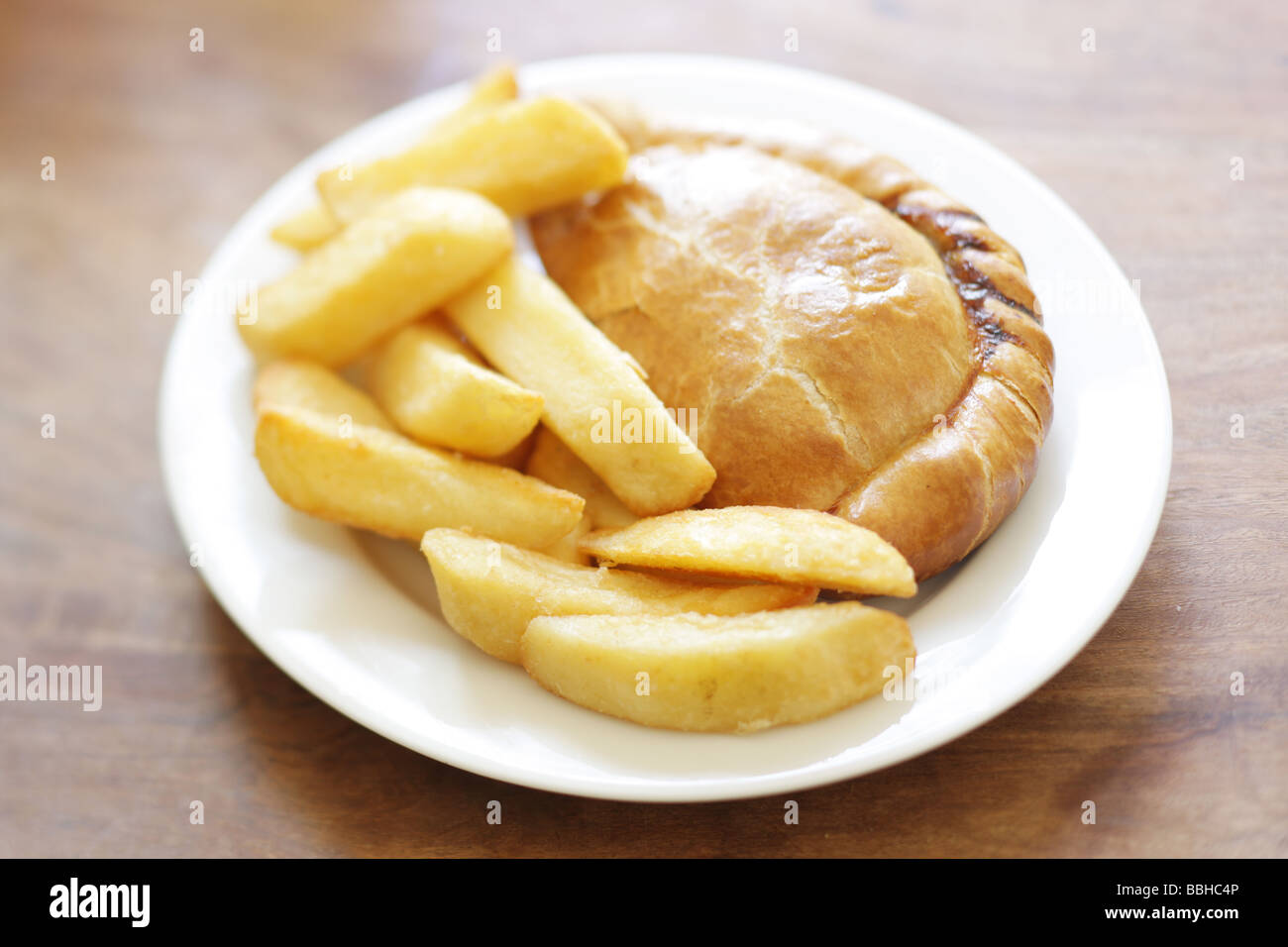 Pasty with Chips Stock Photo - Alamy