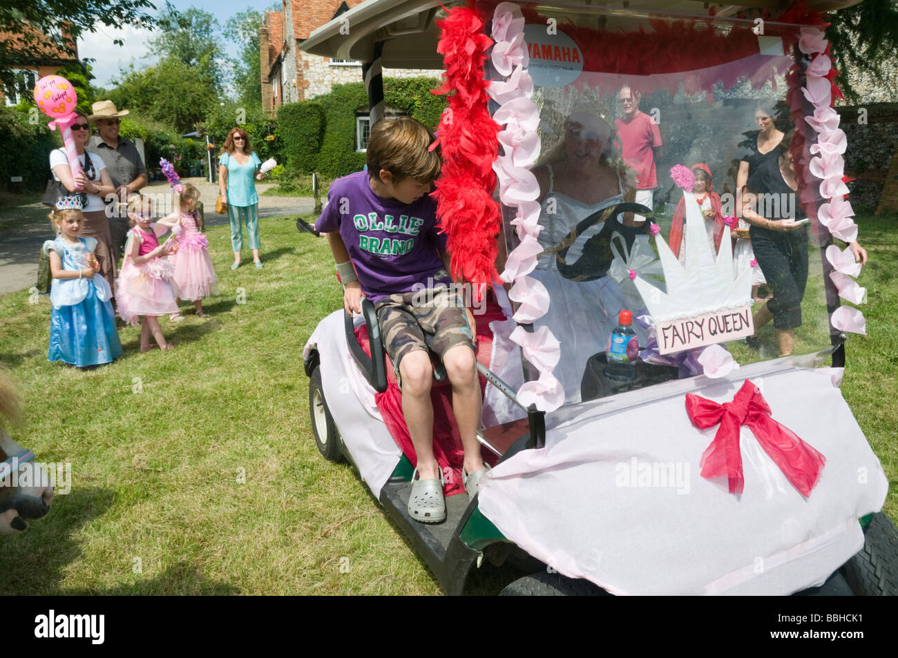 The Fairy Queen in an electric buggy comes to judge the fancy dress ...