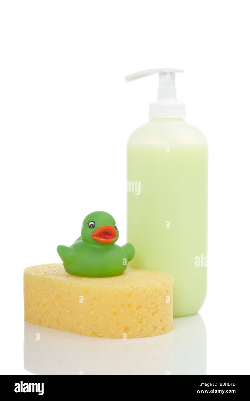 Rubber duck plastic pump soap bottle and sponge reflected on white ...