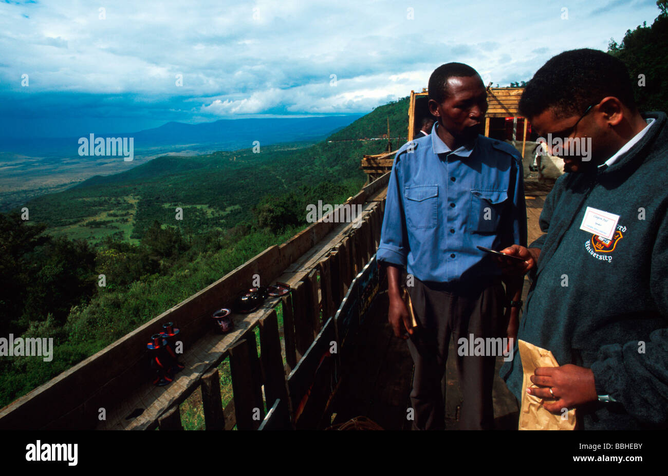 Outside Nairobi Kenya A trader tries to sell goods to a tourist at a ...