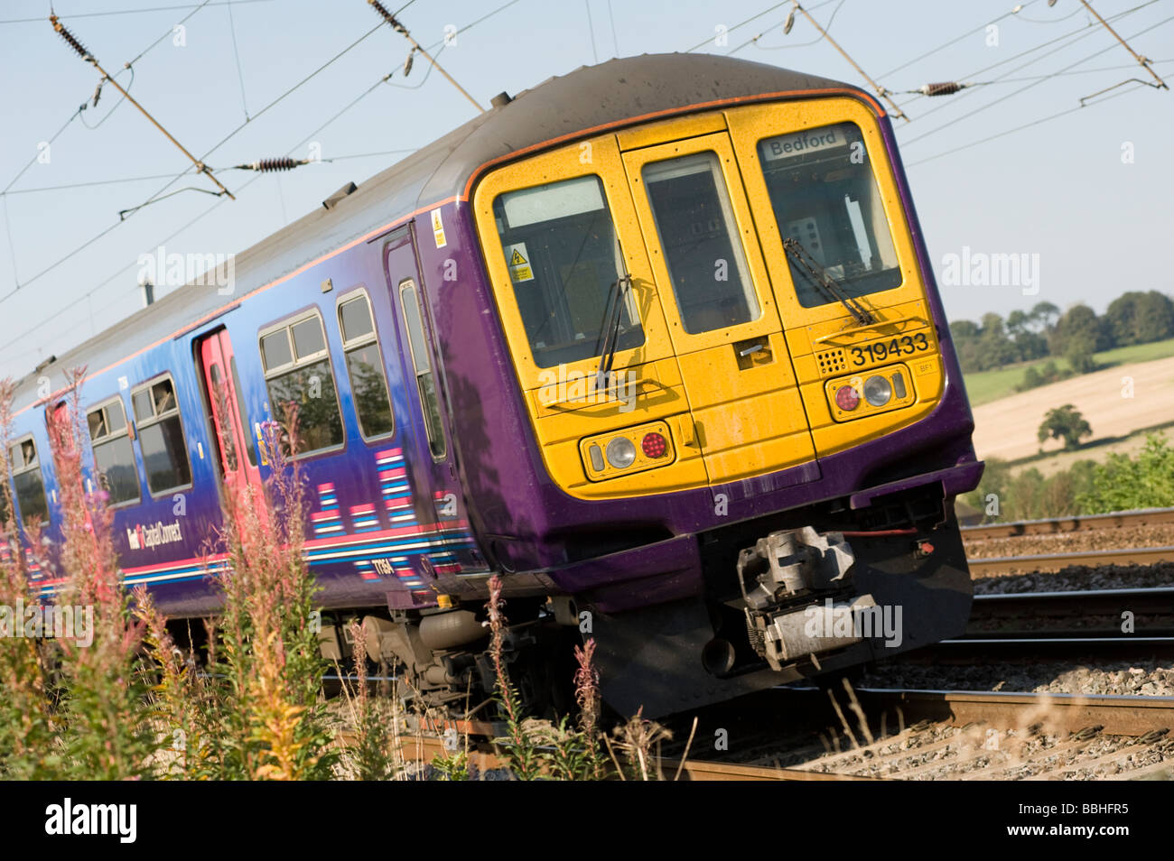 Passenger train class 319 in First Capital Connect livery speeding ...