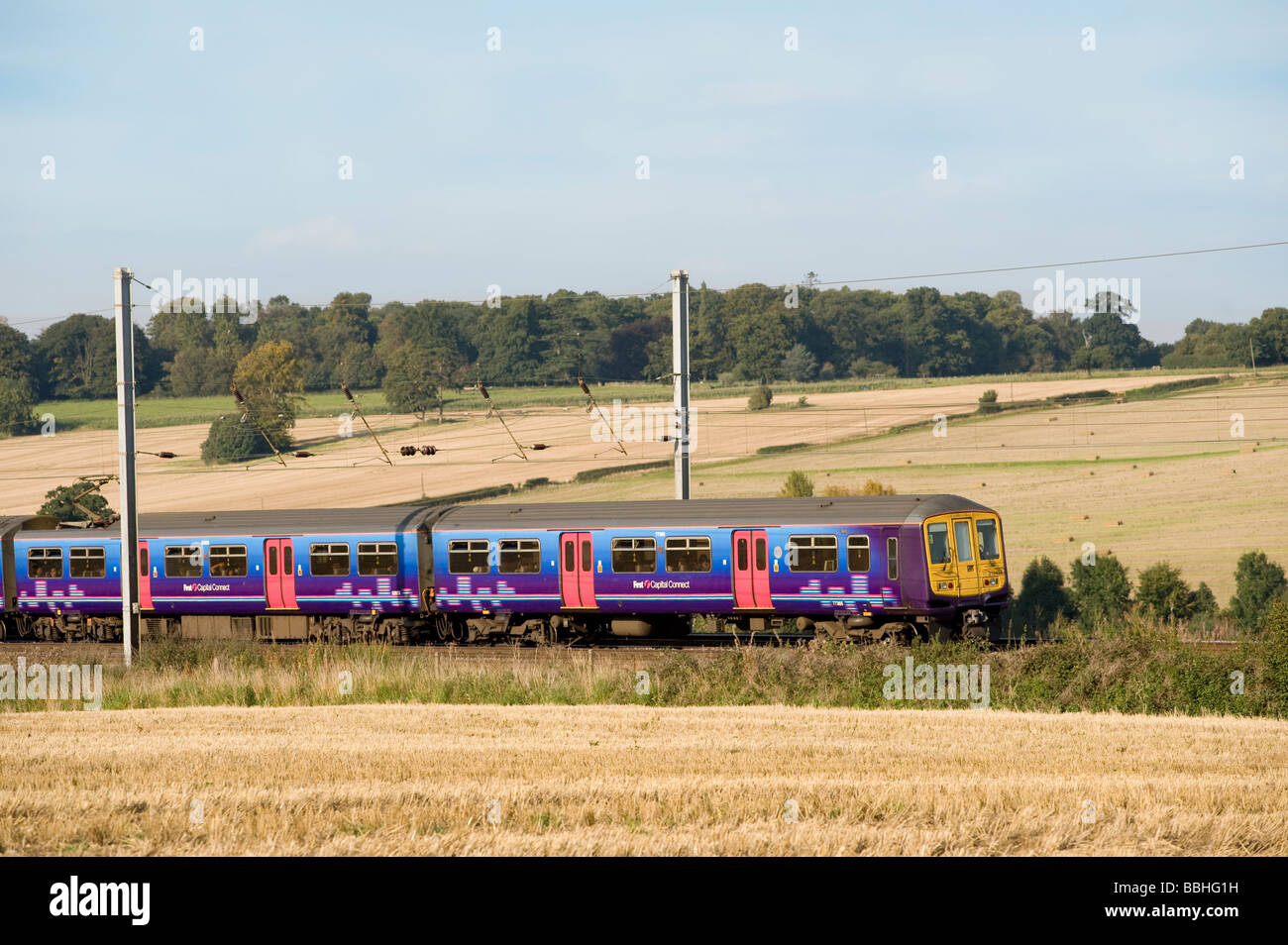 Passenger train class 319 in First Capital Connect livery speeding ...